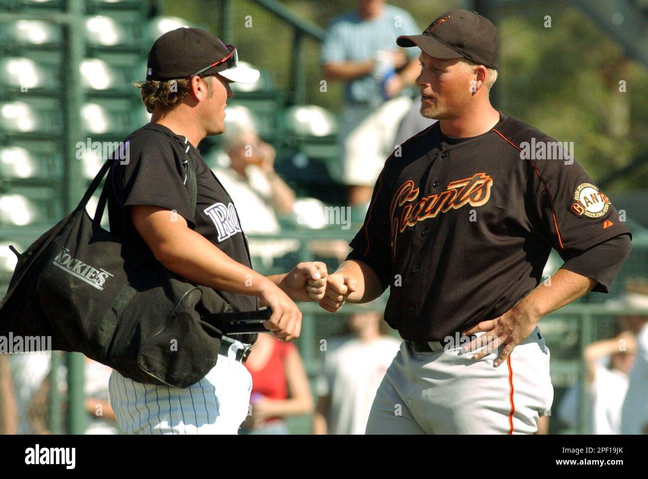 Colorado Rockies infielder Andy Tracy, left, talks with San Francisco ...