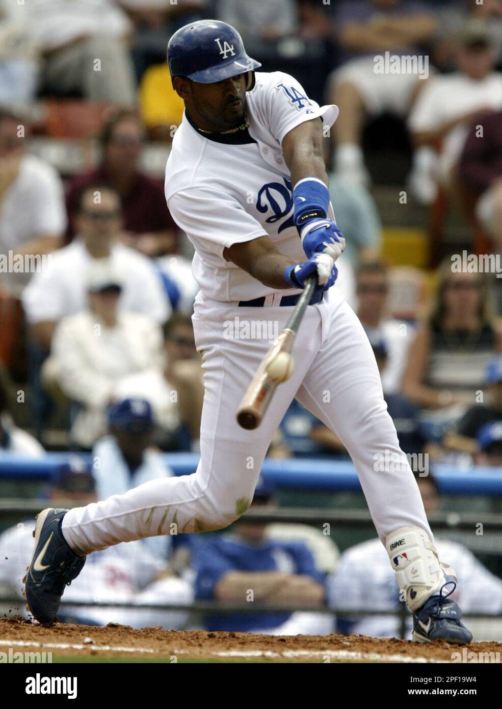 Los Angeles Dodgers infielder Jolbert Cabrera hits a pitch during a ...