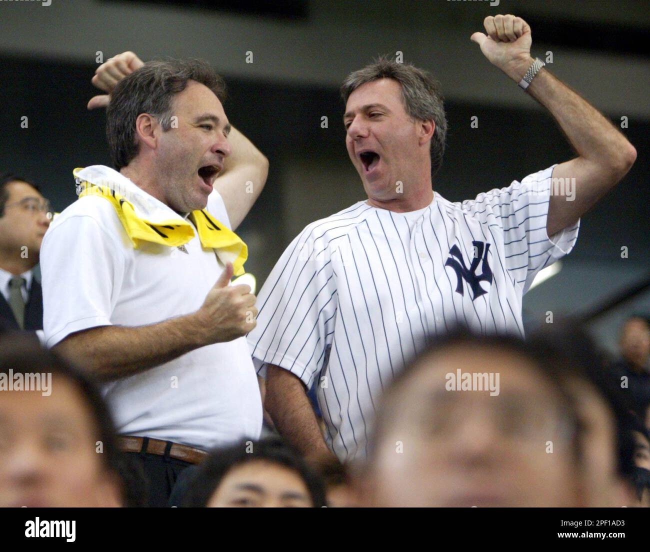 New York Yankees fans stand up to cheer during the exhibition game ...