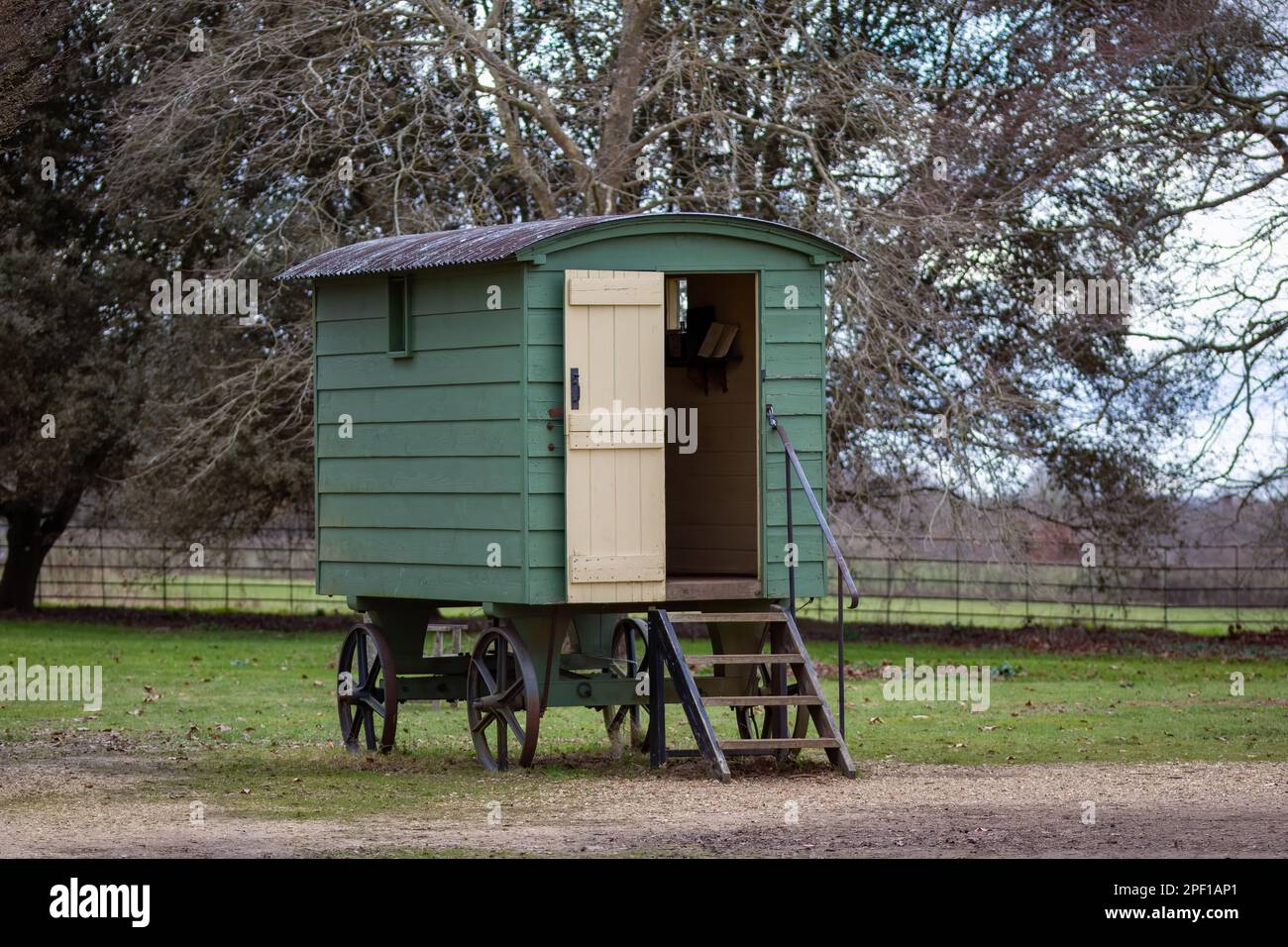 rustic green shepherds hut in the countryside with the door open Stock ...