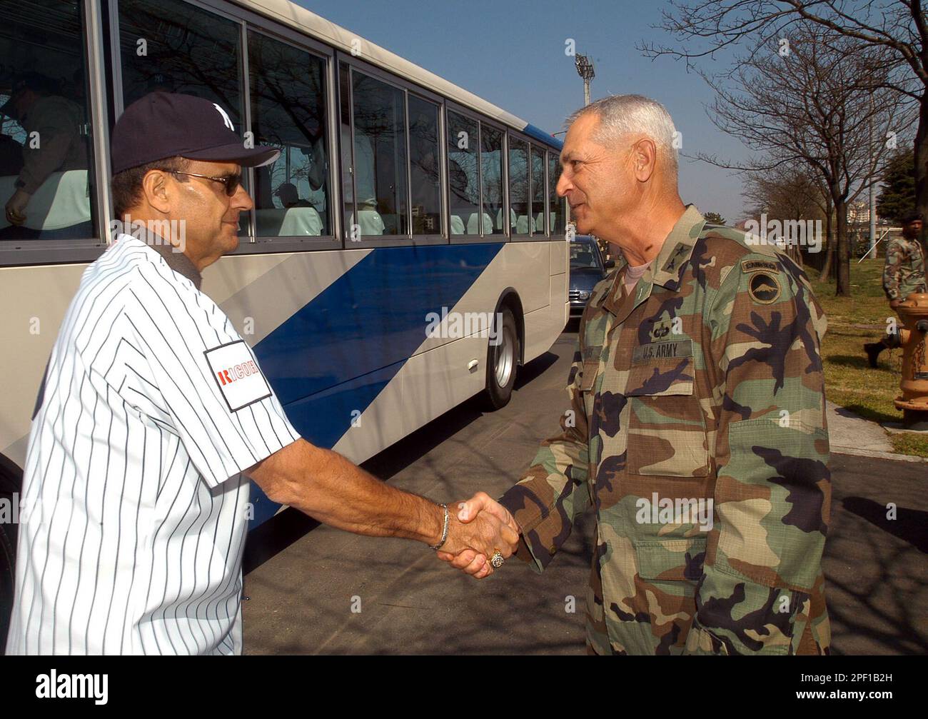 New York Yankees manager Joe Torre, left, is greeted by U.S. Army Maj ...