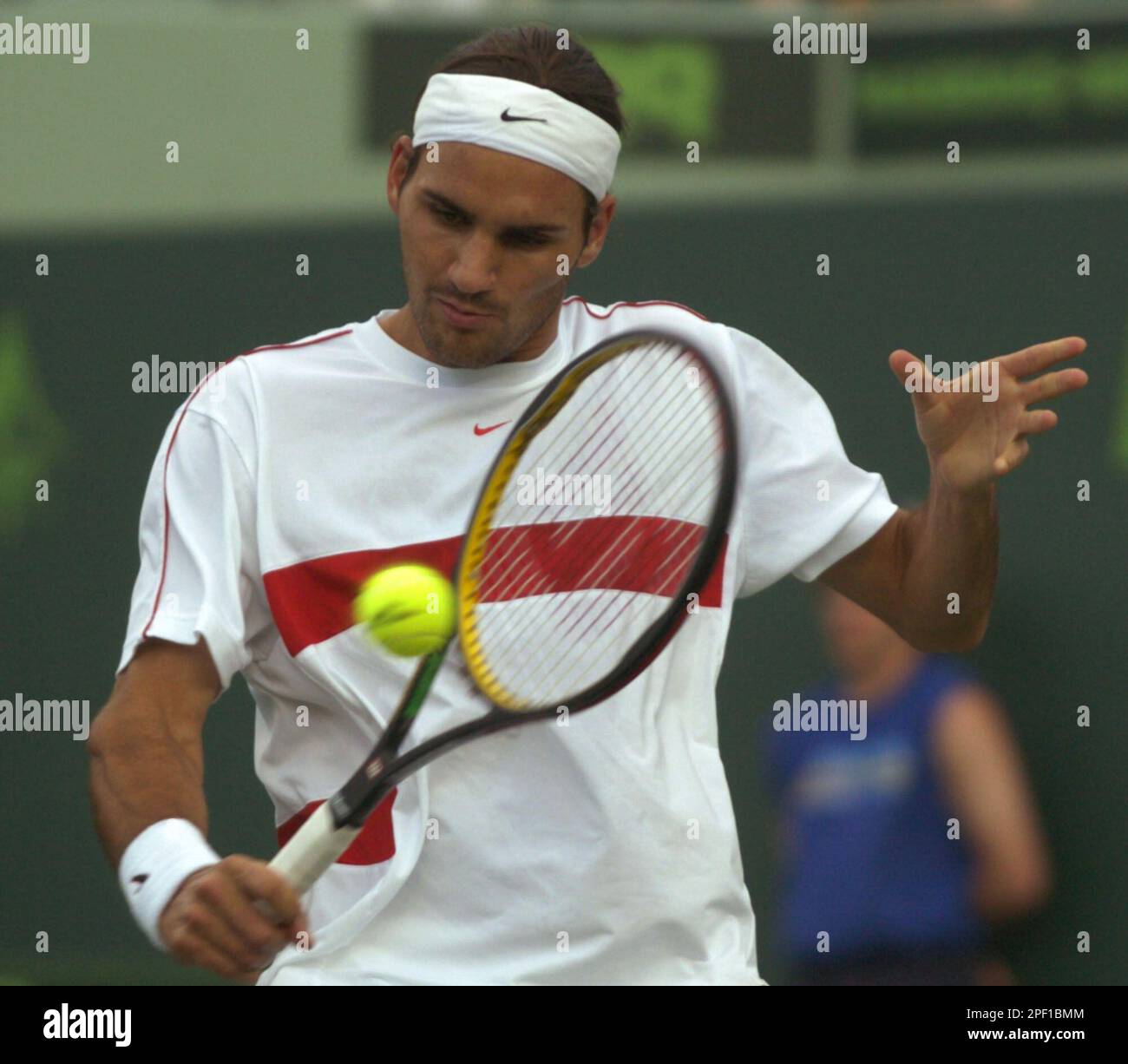 Roger Federer of Switzerland returns a shot from Nikolay Davydenko of ...
