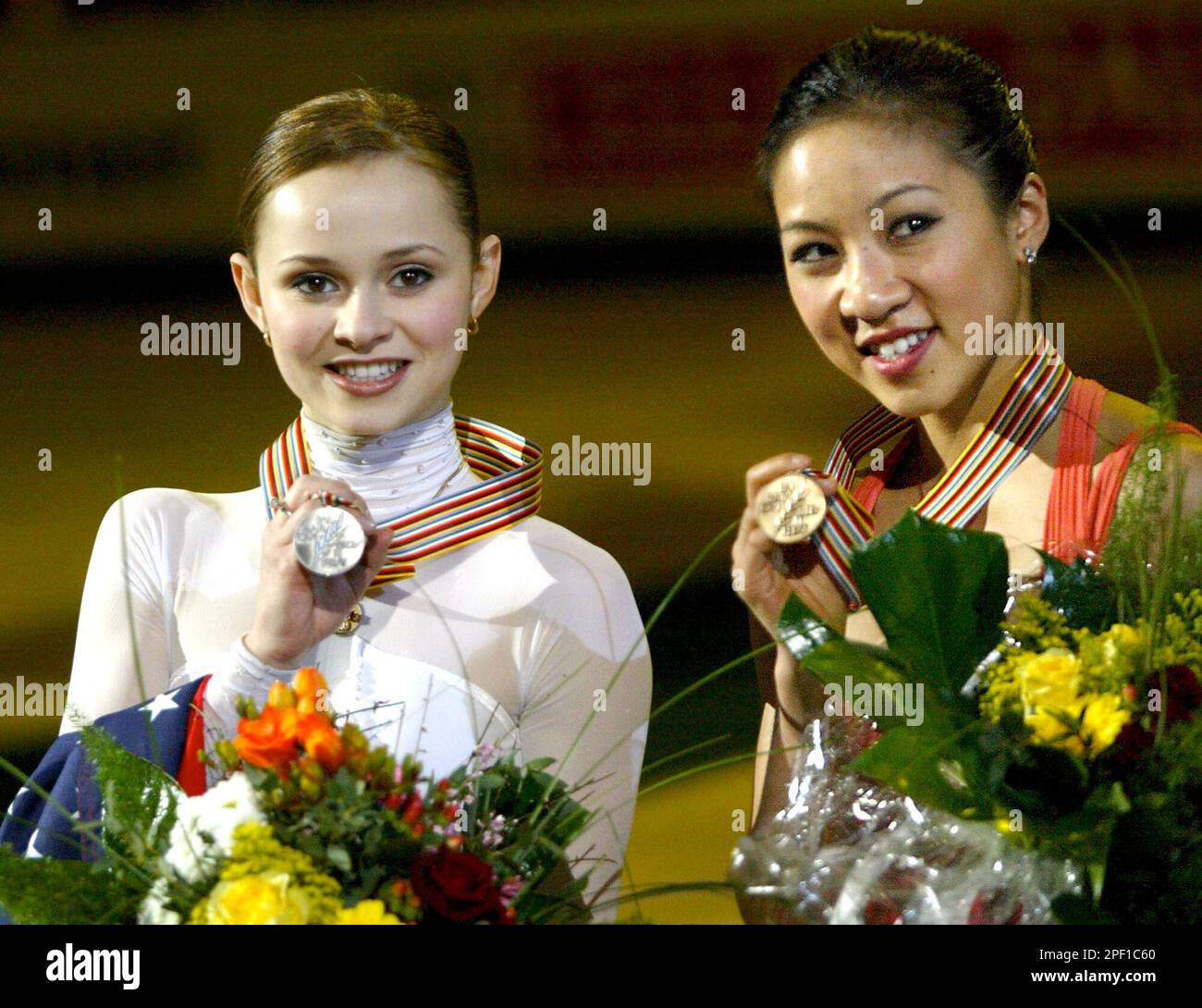 Sasha Cohen and Michelle Kwan from the US, from left to right, show ...