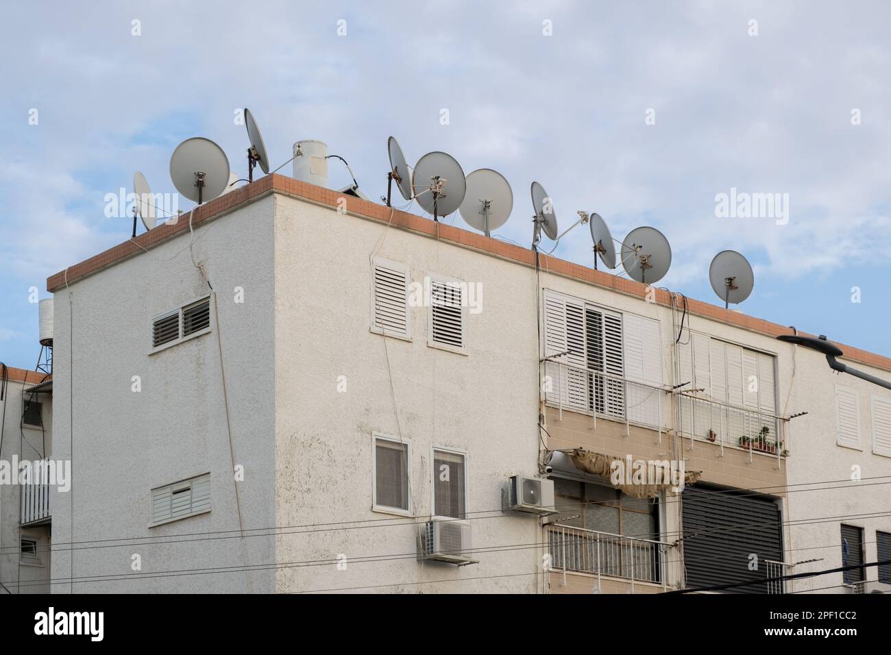 A lot of Satellite dishes, satellite antennas mounted on the roof of ...