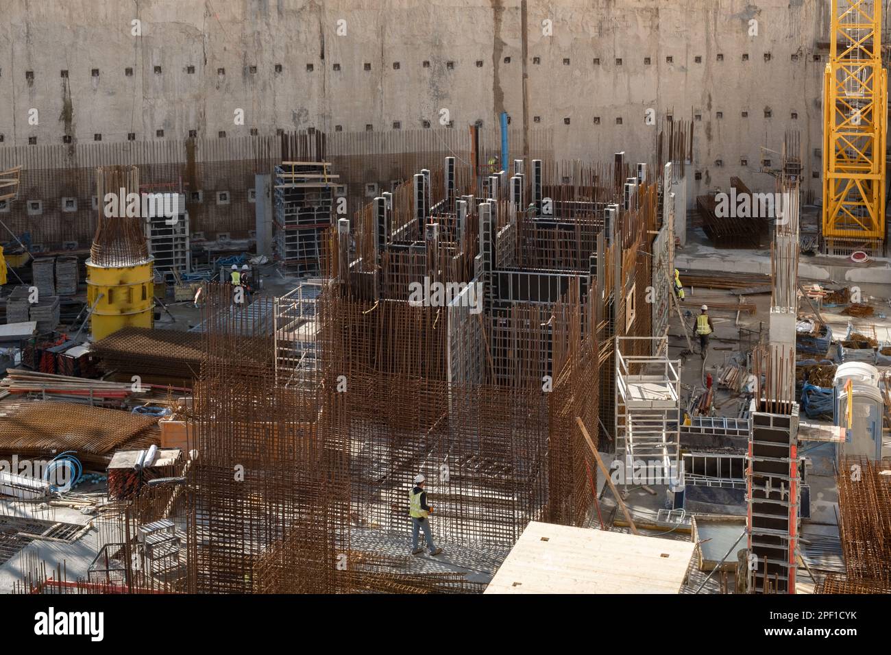 Beginning Laborers work Concrete pillars on the construction site of a ...