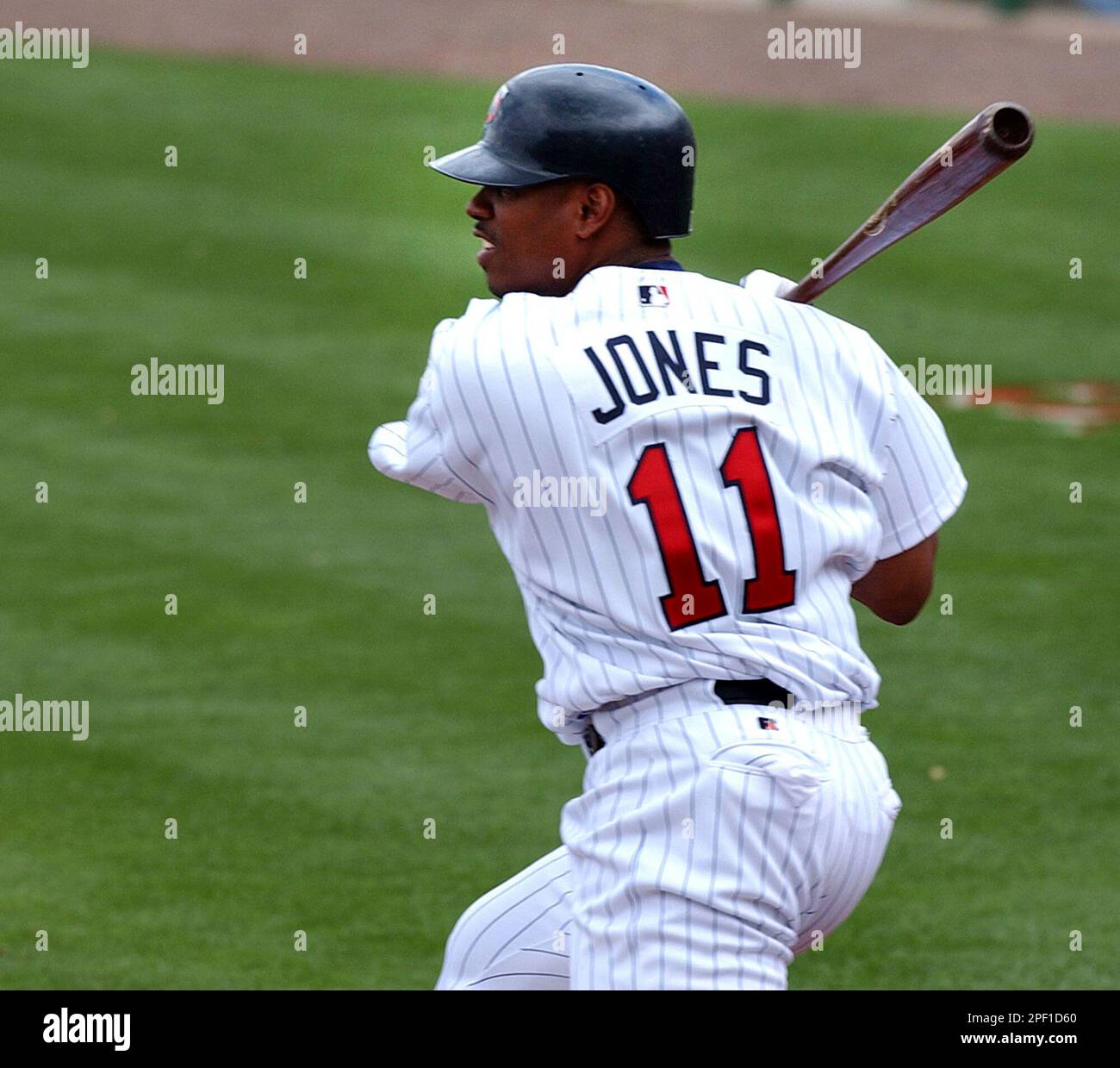 Minnesota Twins' Jacque Jones watches the ball fly on a two-run double ...