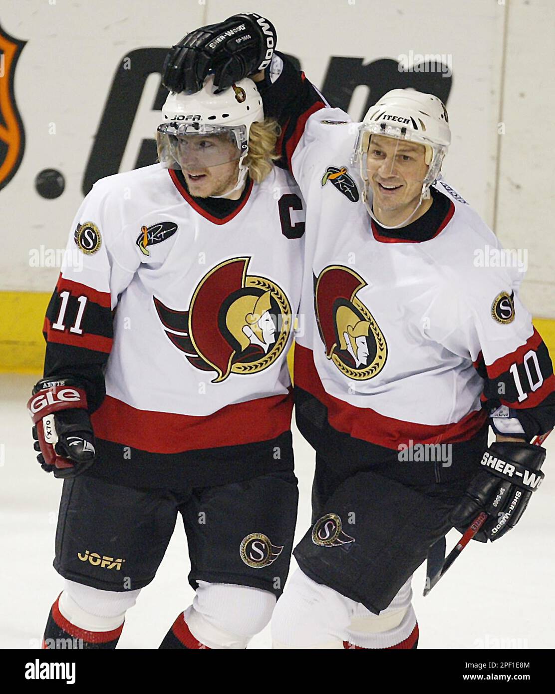 Ottawa Senators' Daniel Alfredsson, left, celebrates his first goal ...