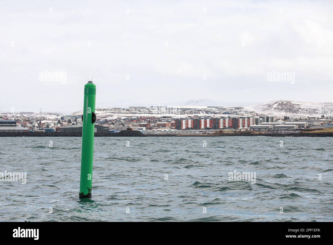 Port hand green spar buoy with light on top. Navigation equipment of ...