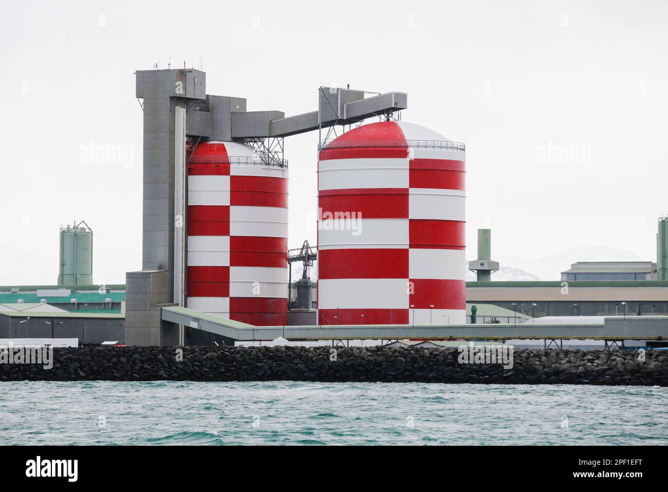 Red white Silo tanks and coastal hangars. Iceland port buildings Stock ...