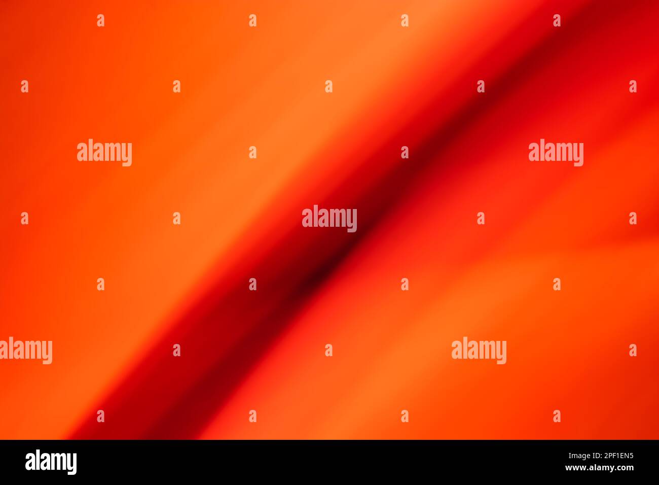 Abstraction red orange background from a wave bend in the middle and a ...