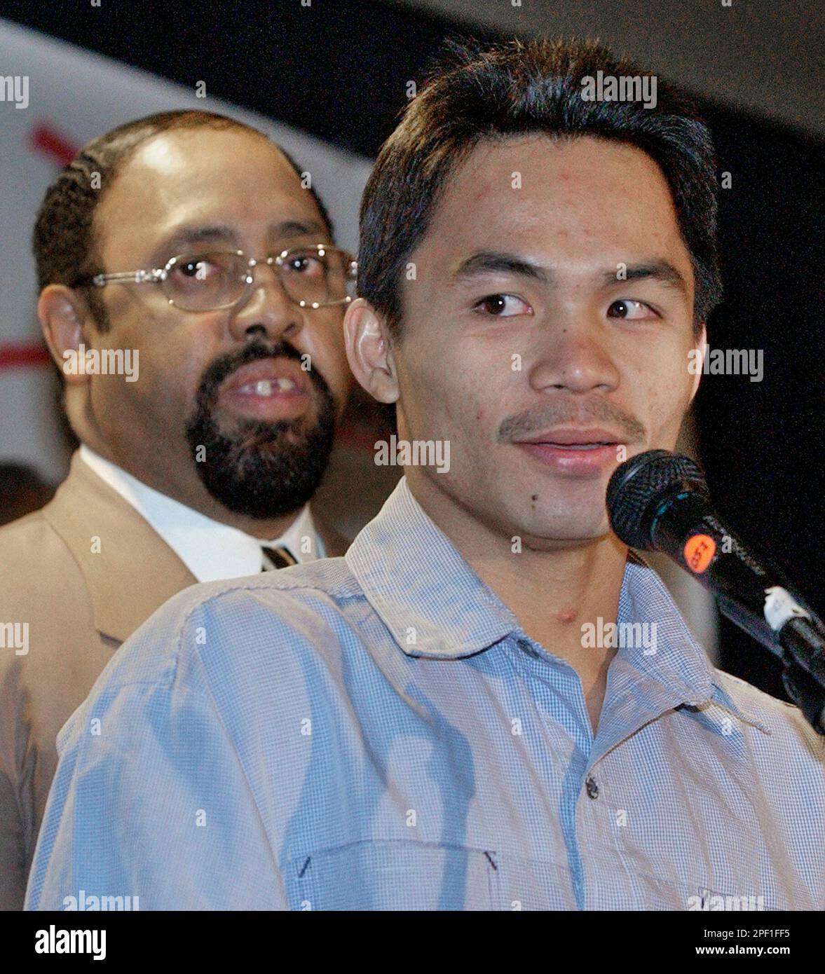 Manny Pacquiao of the Philippines, right, talks about his upcoming IBF ...