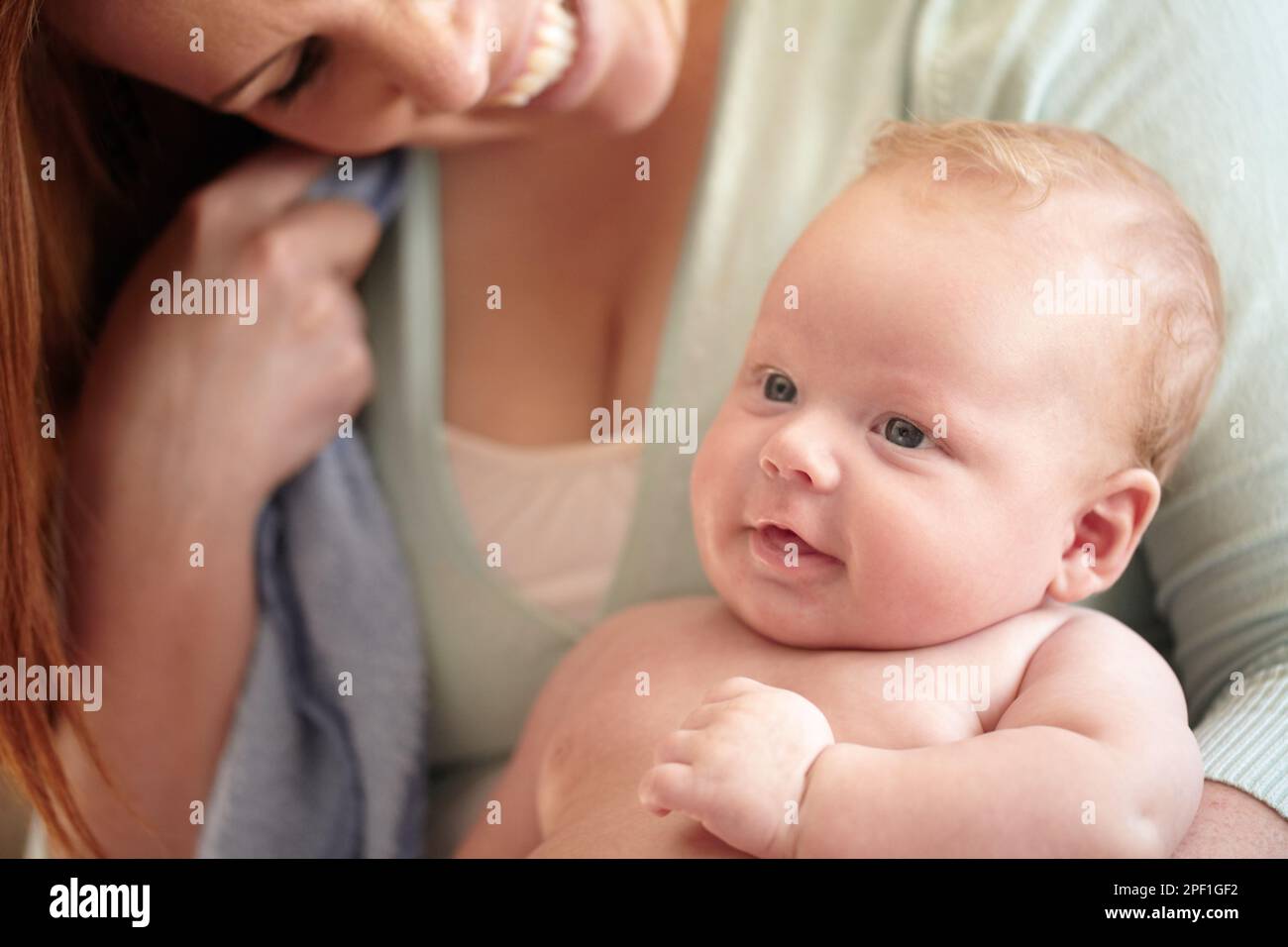 Her world revolves around him. Closeup of a baby boy sitting in his ...