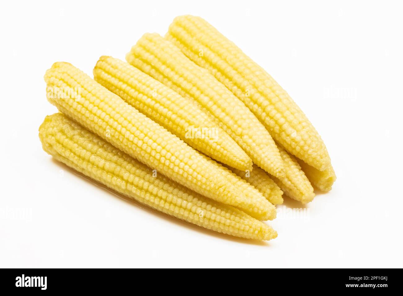 Babycorn pile isolated on white background. Small sweetcorn pickled ...