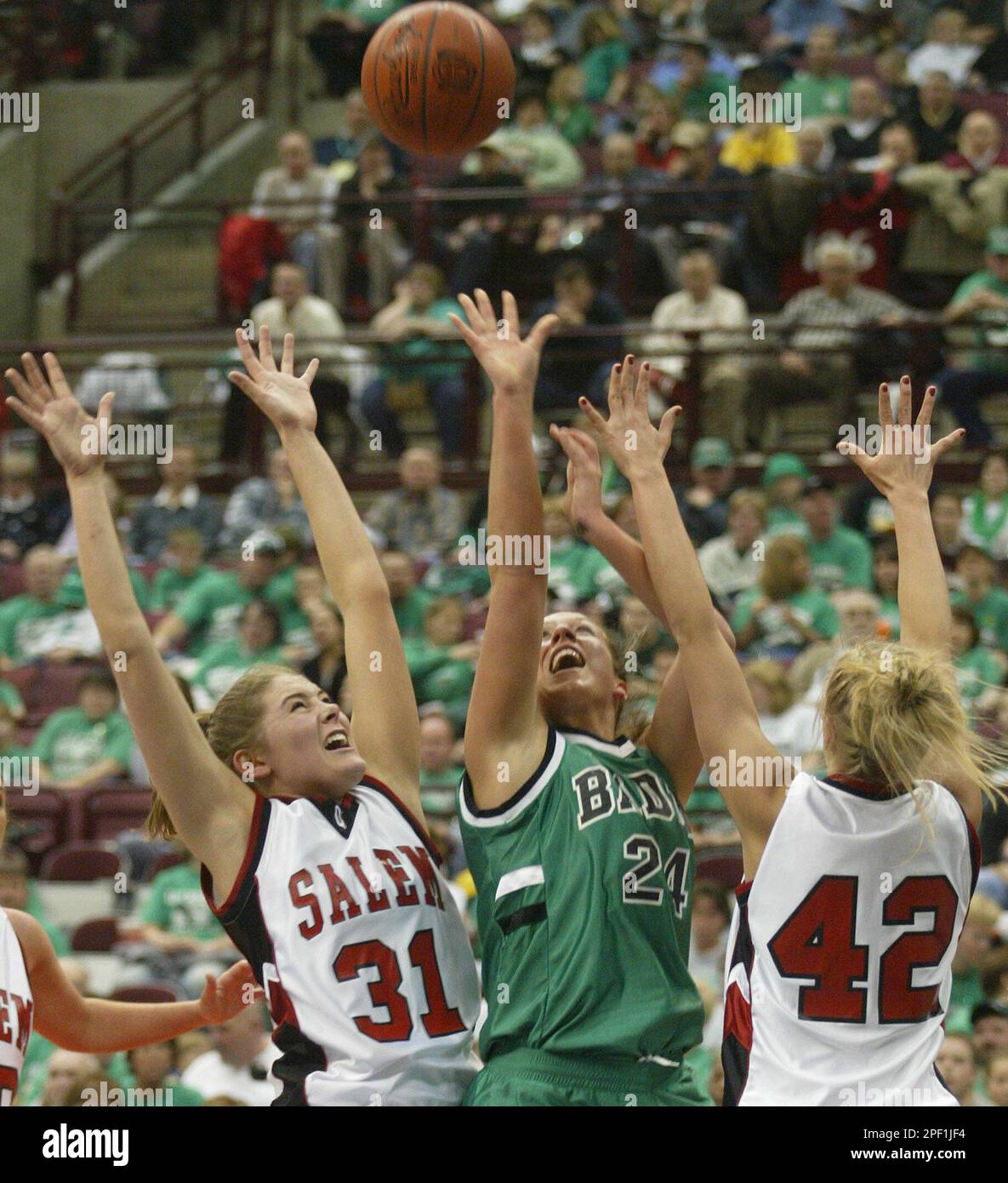 Hamilton Badin's Jenni Harvath (24) takes a shot while being guarded by ...