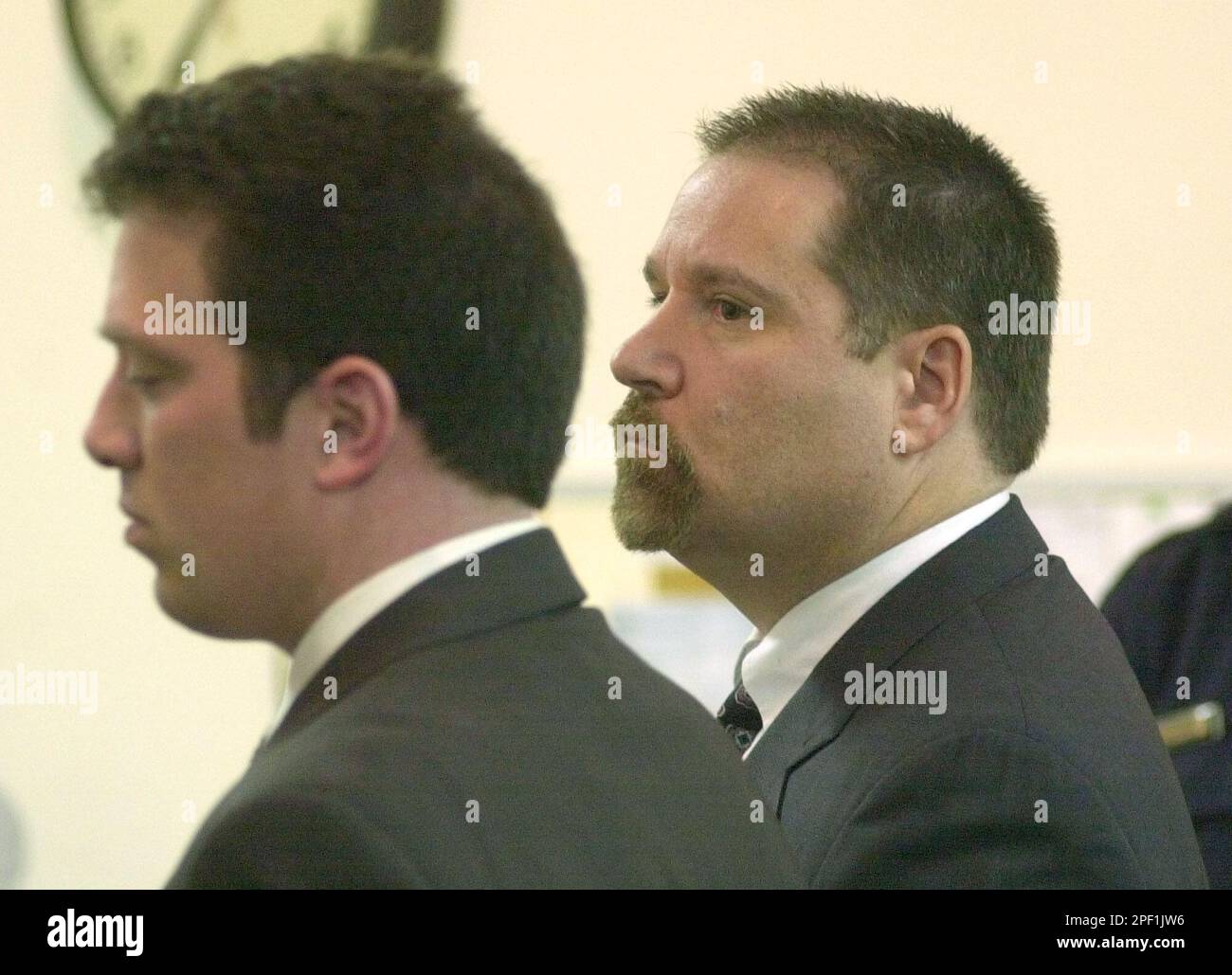 Brett Cashman, right, and John T. Price listen as they stand before ...