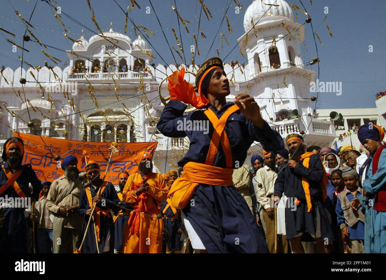A youth dressed as a traditional Sikh warrior rotates a "Chakkar," a ...