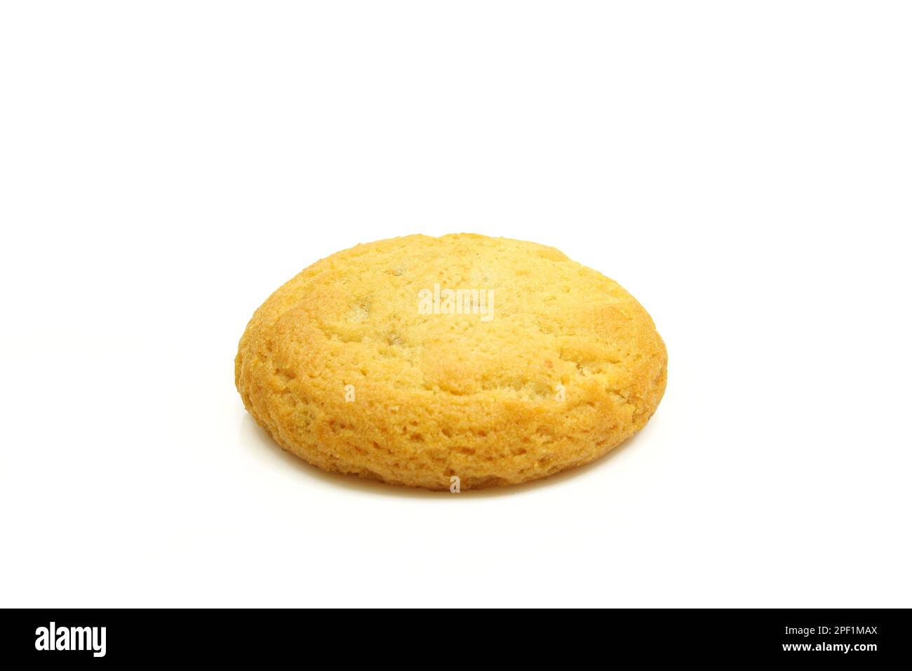 Single small golden treat cookie biscuit isolated on white background ...