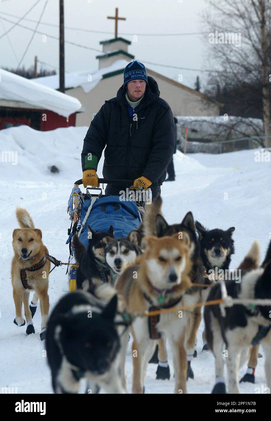 Nils Hahn of Germany drives his dog team out of the Ruby, Alaska ...