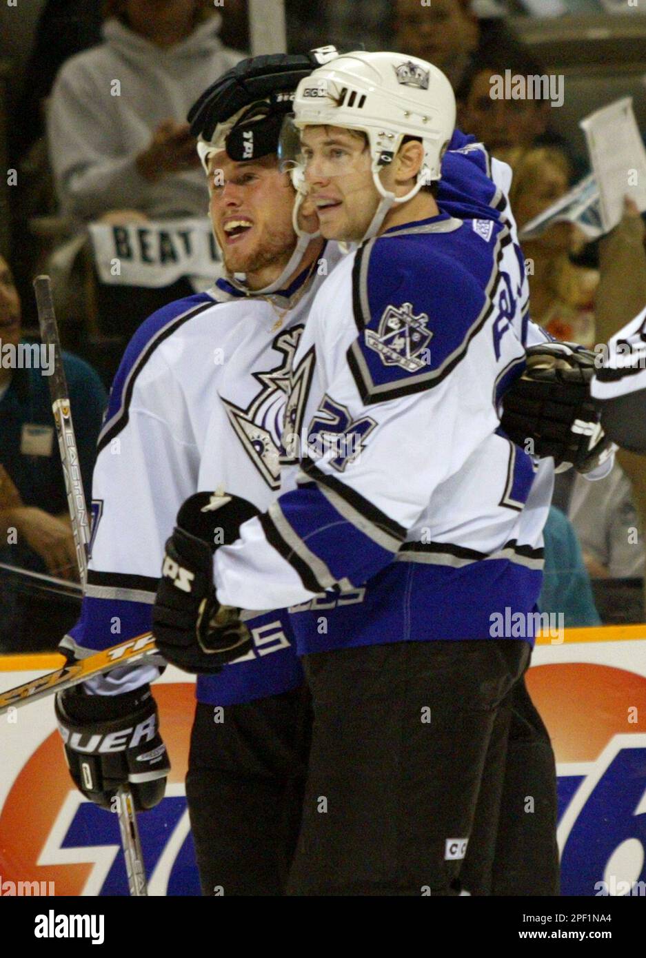 Los Angeles Kings' Joe Corvo, left, celebrates with teammate Alexander ...