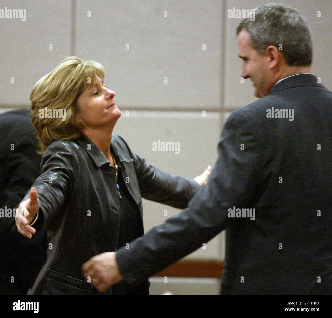 Clare Rochester gets ready to hug her brother, Michael Blagg, after a ...