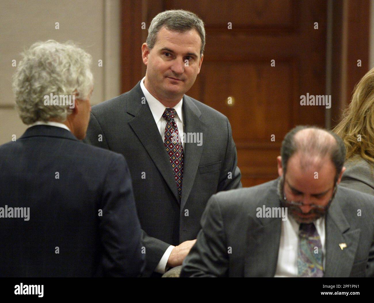 Michael Blagg, center, is flanked by his attorneys David Eisner, left ...