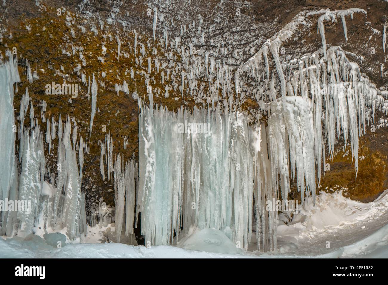 Icy stalagmites created from the side of a mountain next to the ...
