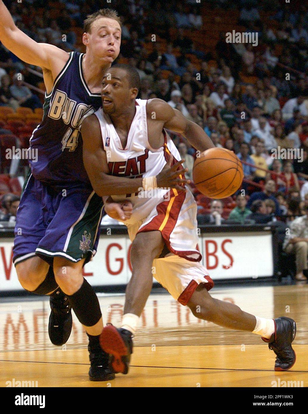 Miami Heat's Rafer Alston, right, drives past Milwaukee Bucks' Keith ...