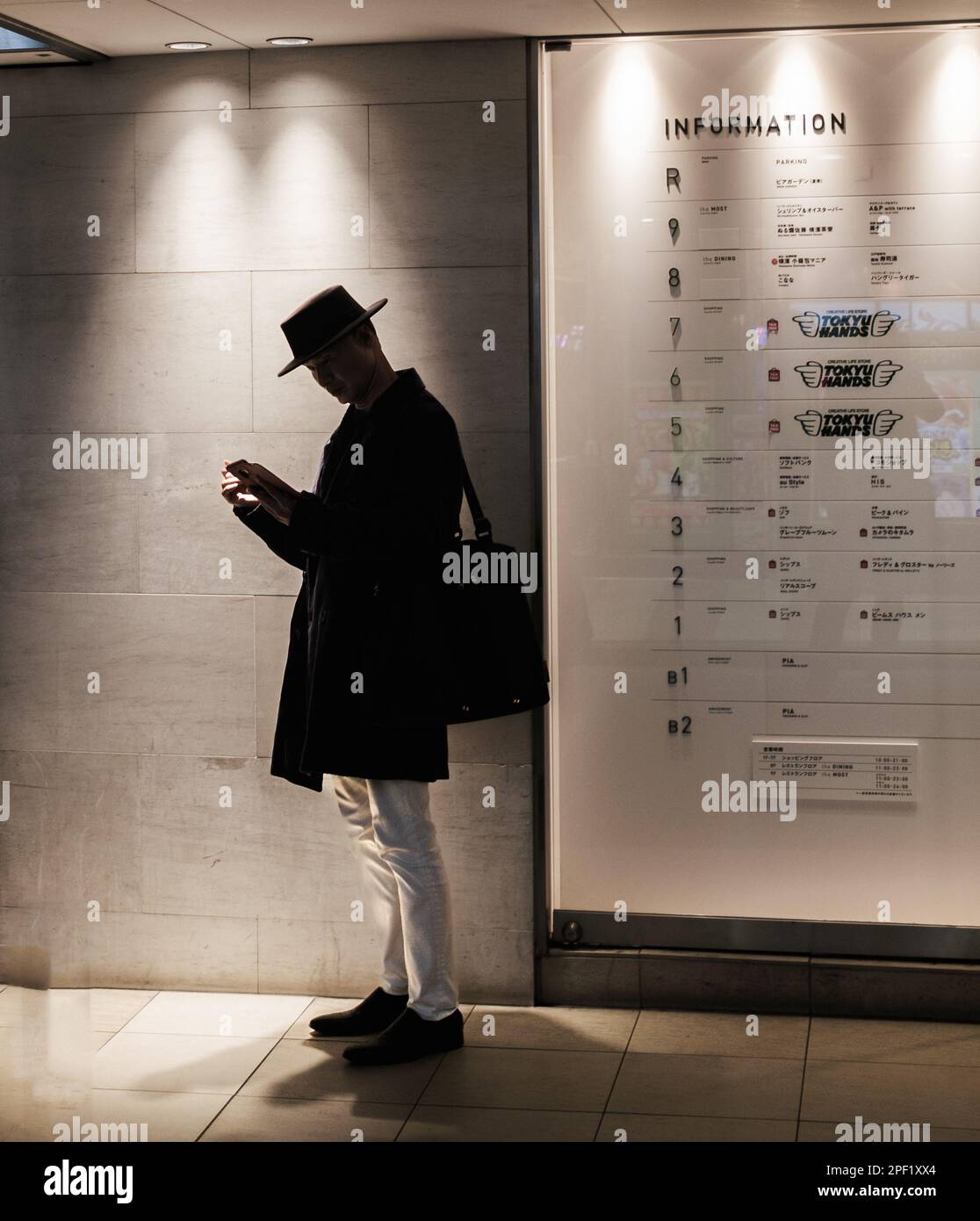 Unlike the vast majority of Japanese salarymen who wear the standard ...