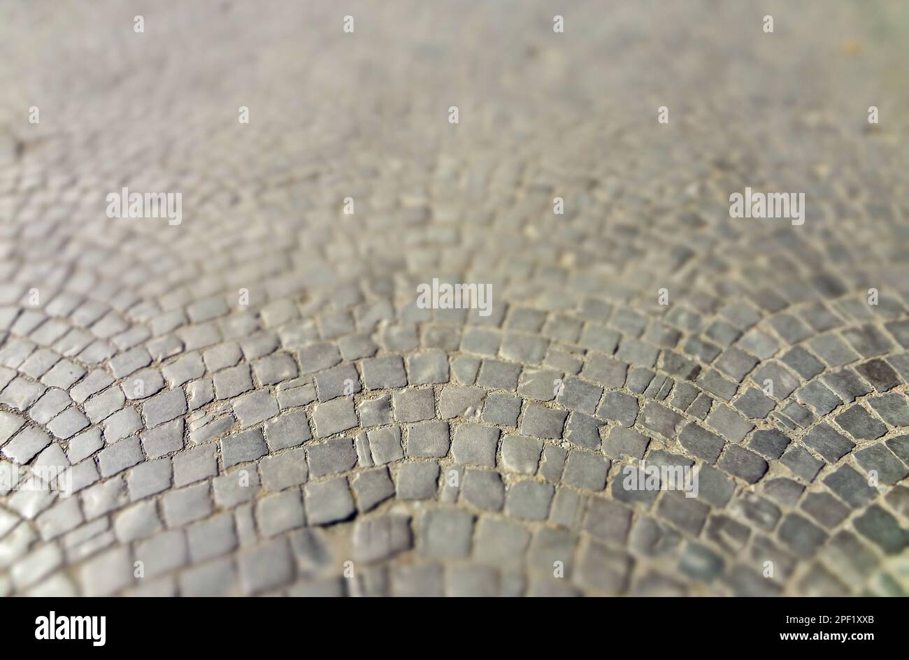 The bridge of the old city is made of granite pebbles. Selective focus ...