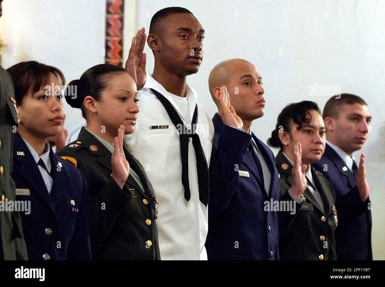 Army Pfc. Marlenny Fernandez, second from left, is one of 38 soldiers ...