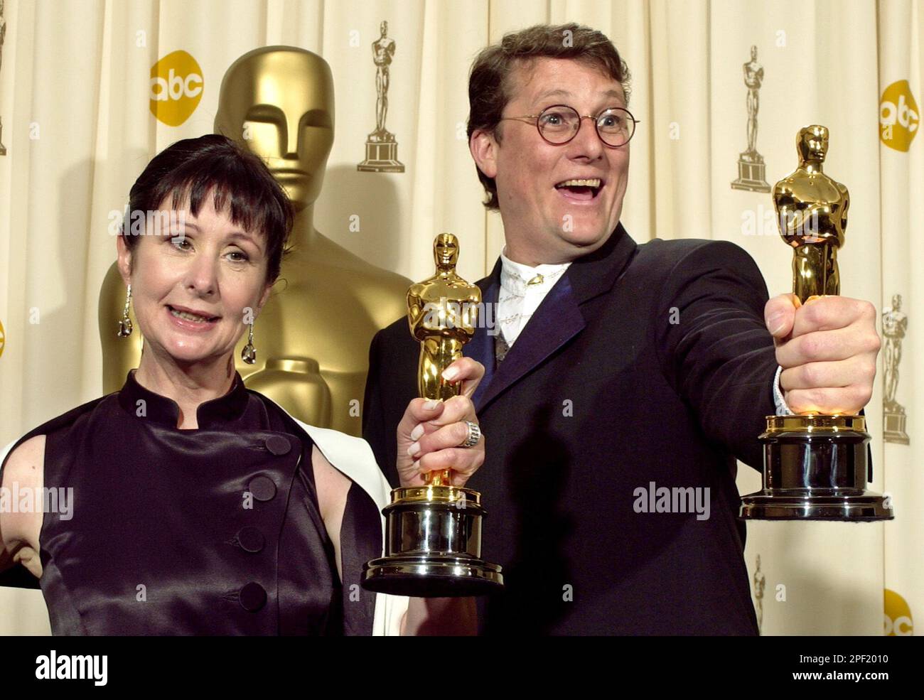 Ngila Dickson, left, and Richard Taylor hold the Oscars they won in ...