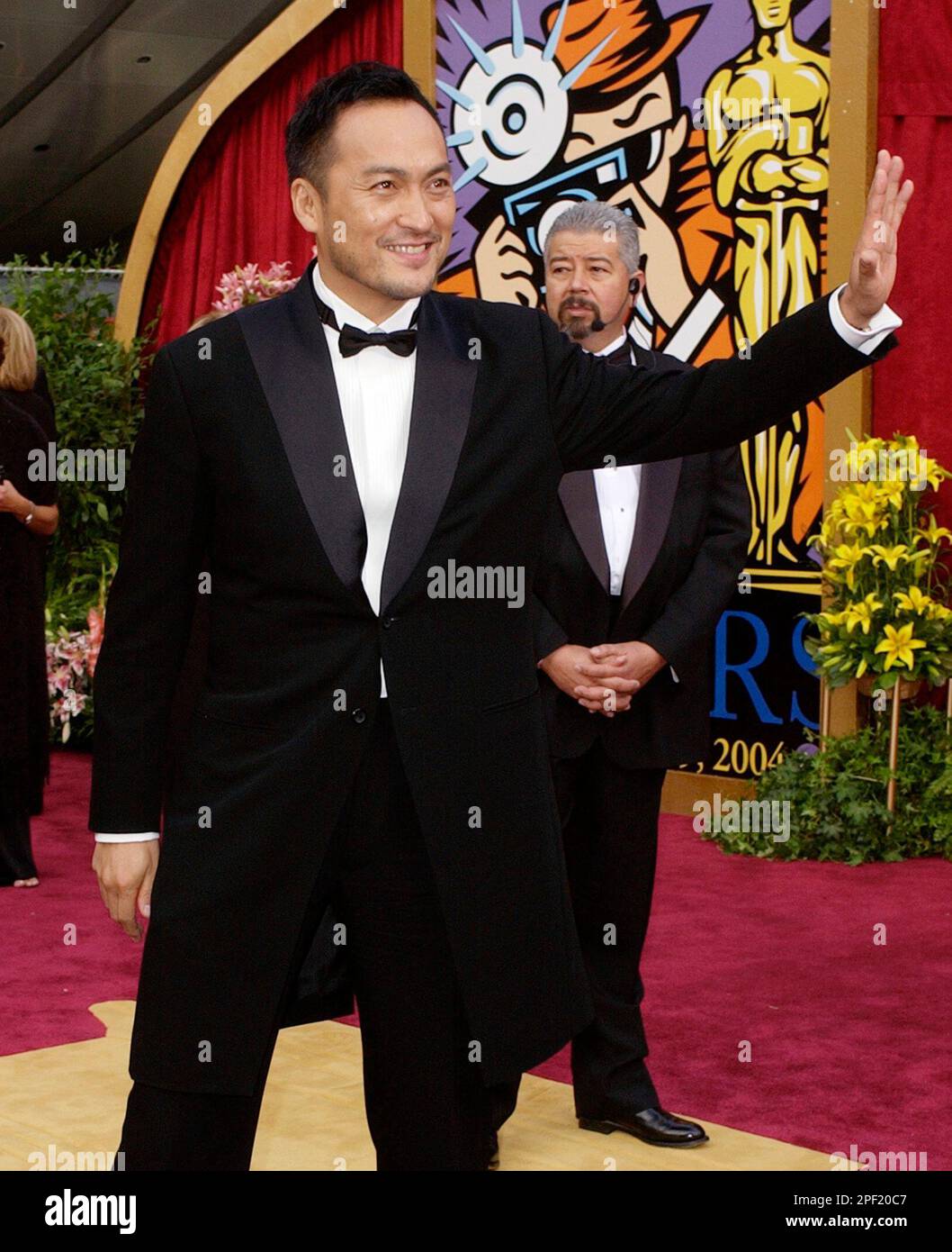 Japanese actor Ken Watanabe waves as he arrives for the 76th annual ...