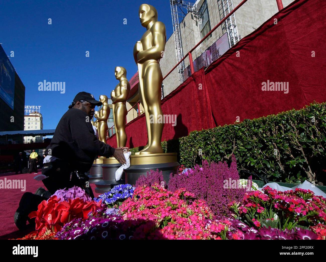 Local 33 worker Frank Roach polishes Oscar statues on the red carpet ...