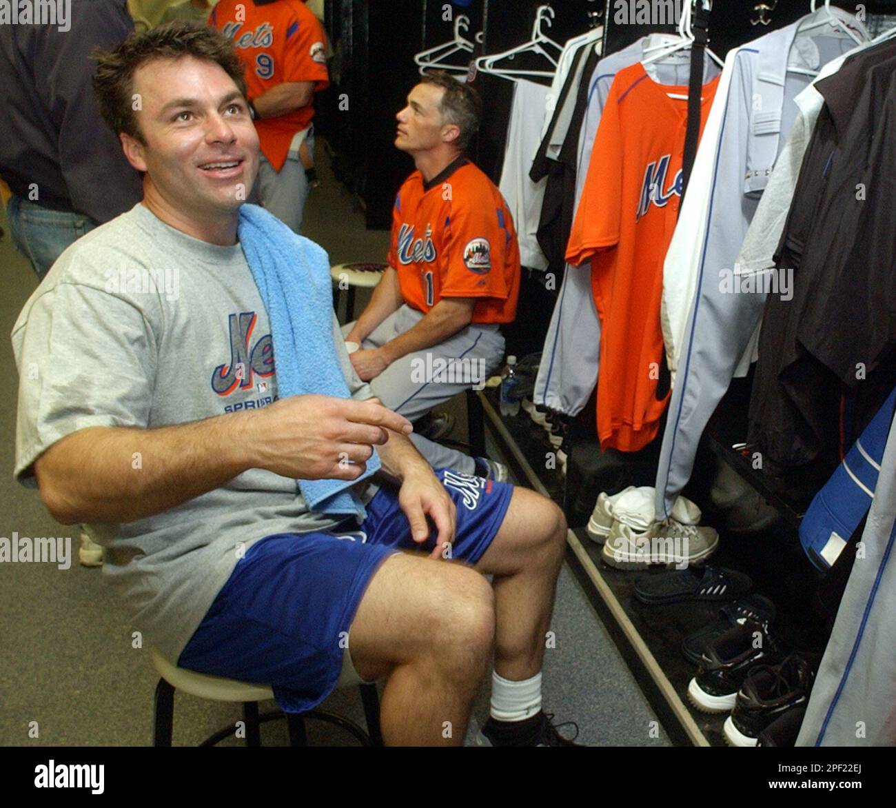 New York Mets Todd Zeile, left, sits at his locker as he gets ready for ...
