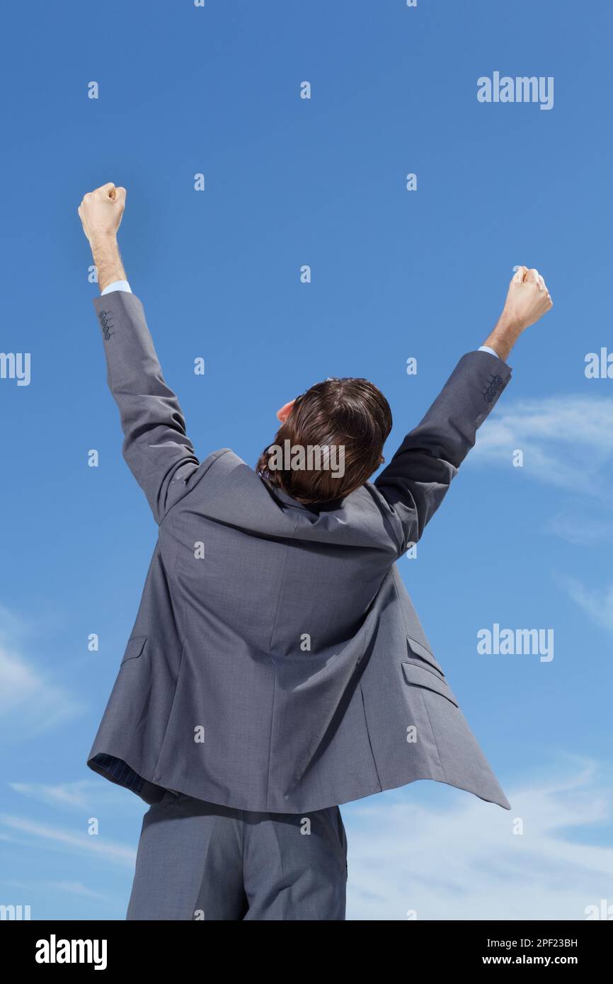 Winner. A successful businessman celebrating an approved contract Stock ...