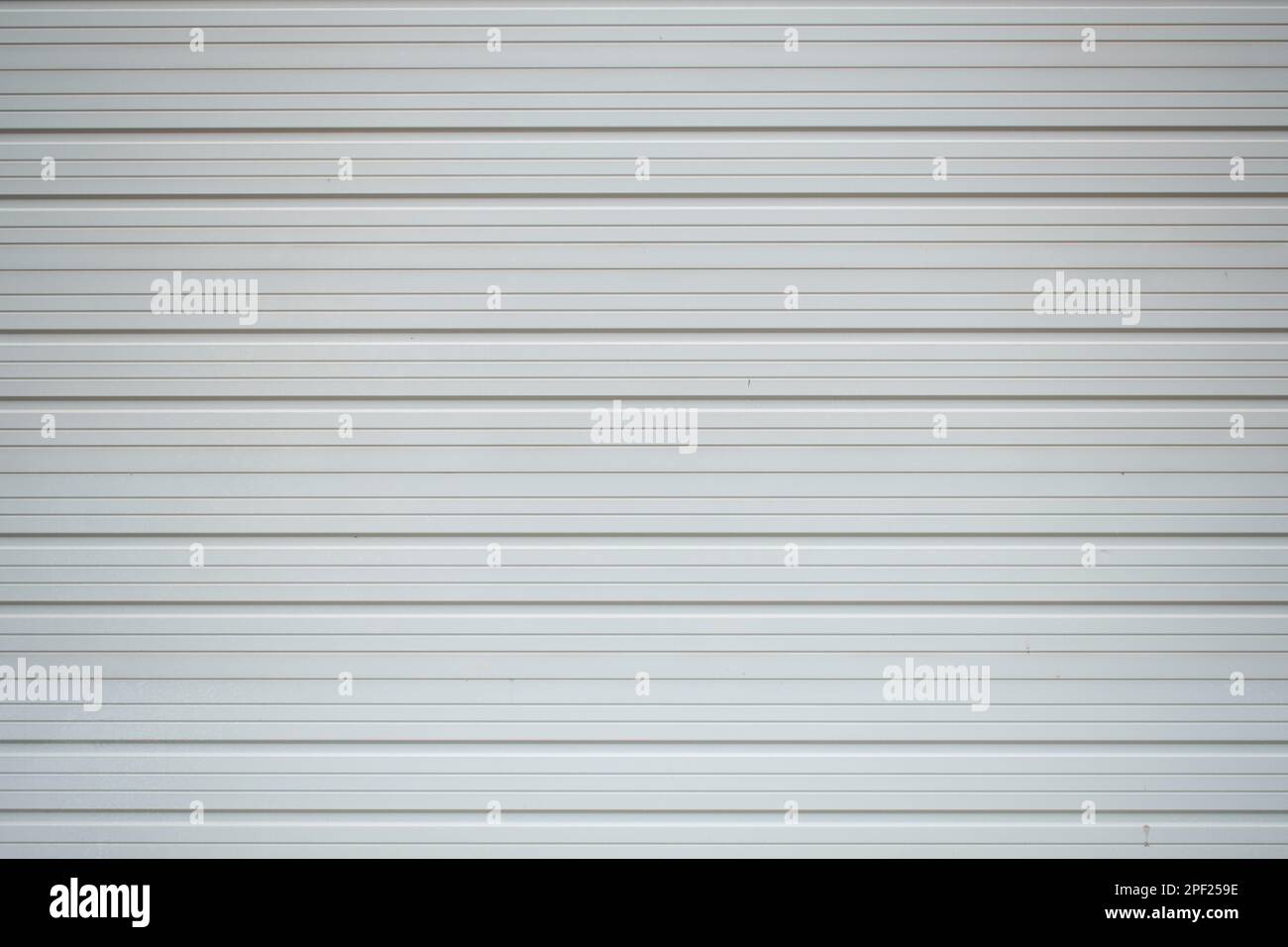 White corrugated metal warehouse door Stock Photo - Alamy