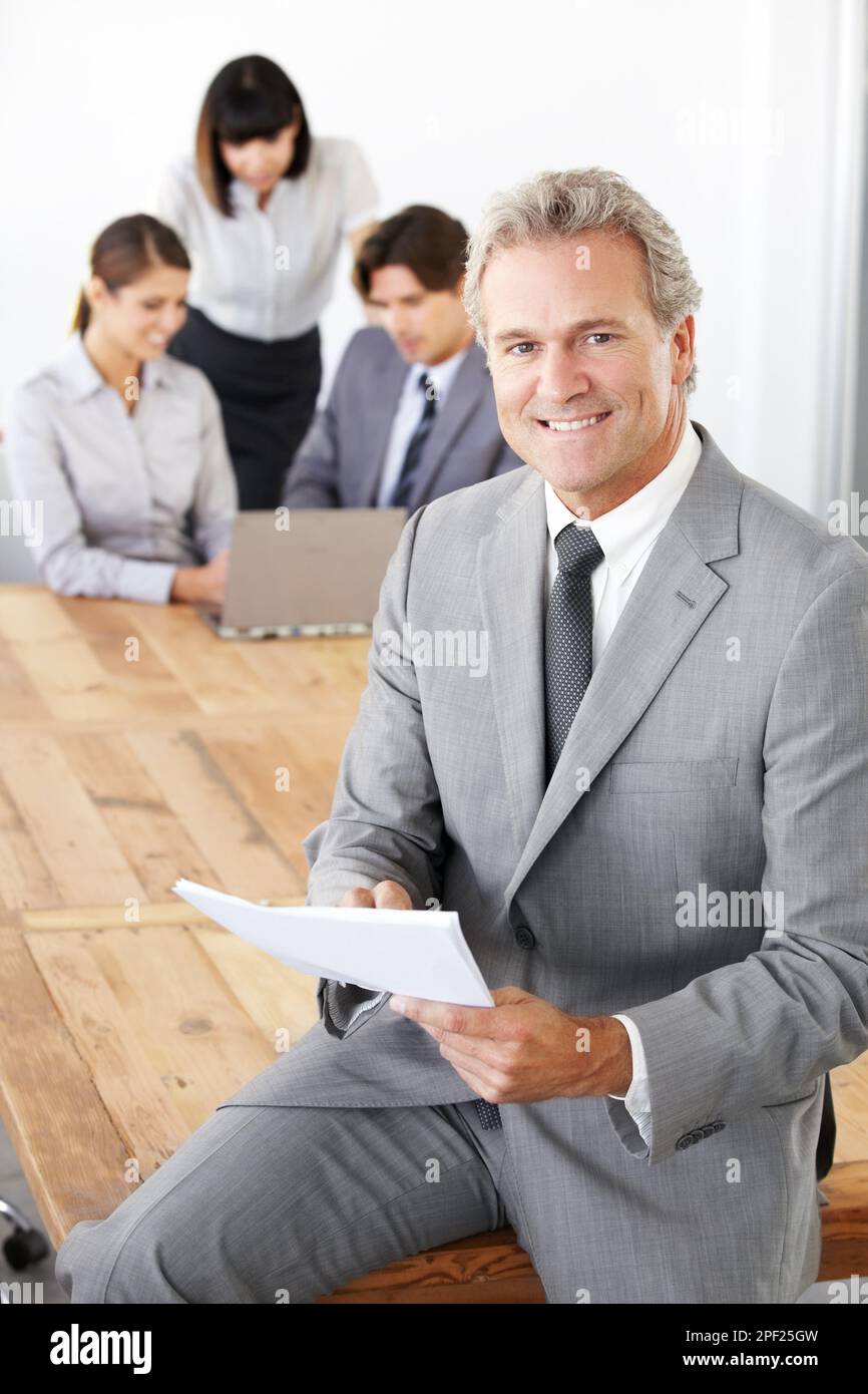 His leadership brings them together. A goodlooking senior business ...