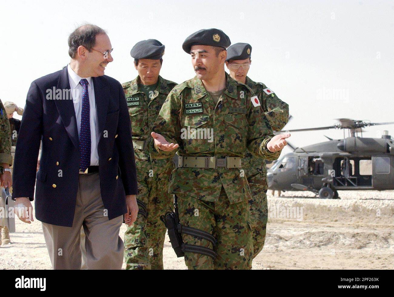 Dov Zakheim, left, U.S. Undersecretary of Defense, is greeted by ...