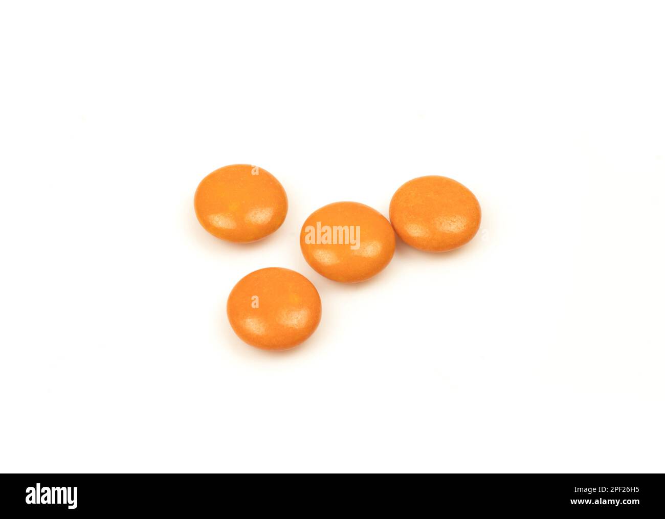 Few orange drops isolated on white background. Mint flavoured candies ...