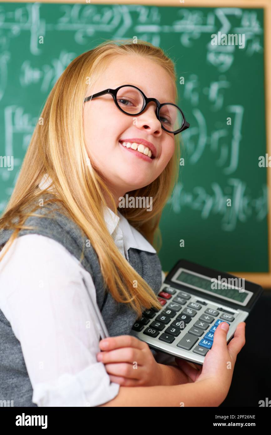 Happy with the solution. A cute blonde girl with a pen and calculator ...
