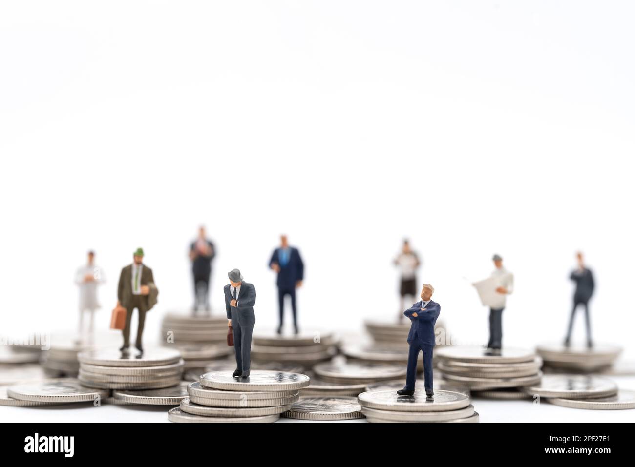 Business amd Money Concept. Group of businessman miniature figures ...