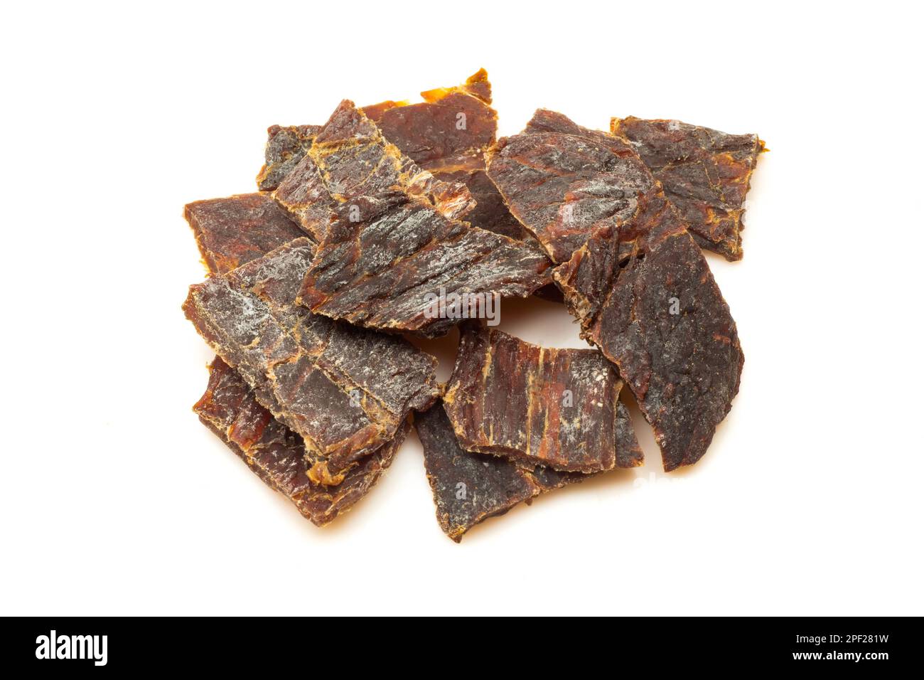 Stack of dry meat slices isolated on white background. Beef jerky ...