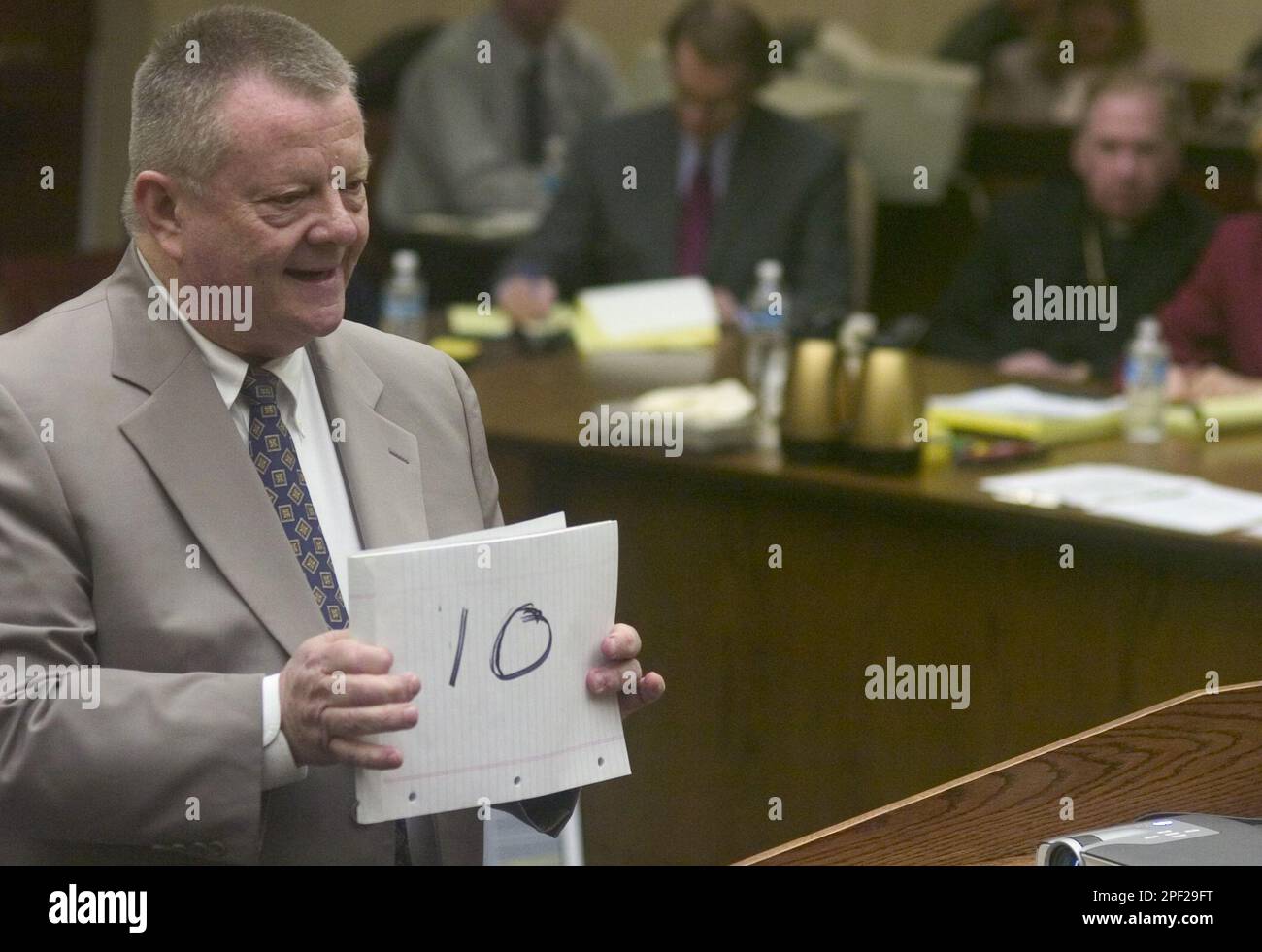 Bishop Thomas O'Brien's defense attorney Tom Henze,left, gives his ...