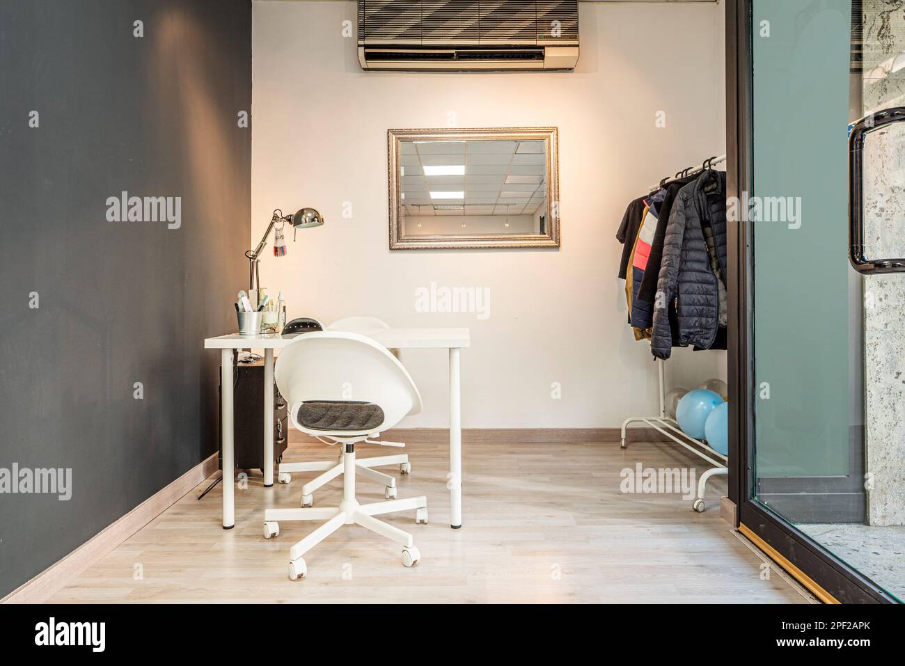 Plain white table of a beauty salon dedicated to the treatment of nails ...