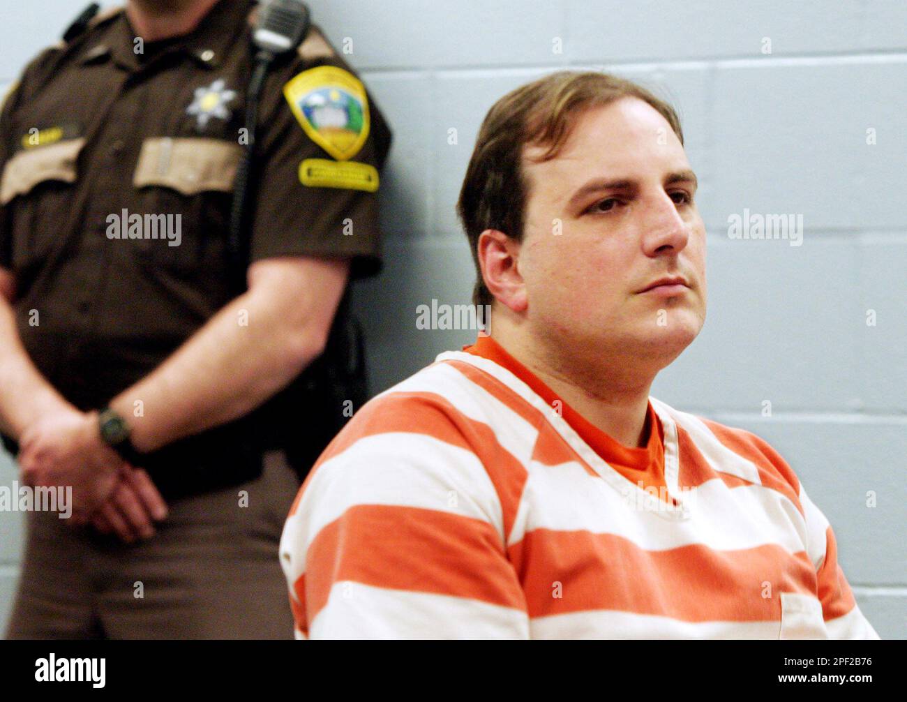 Barry Richard Dent listens to the judge's comments during a video ...