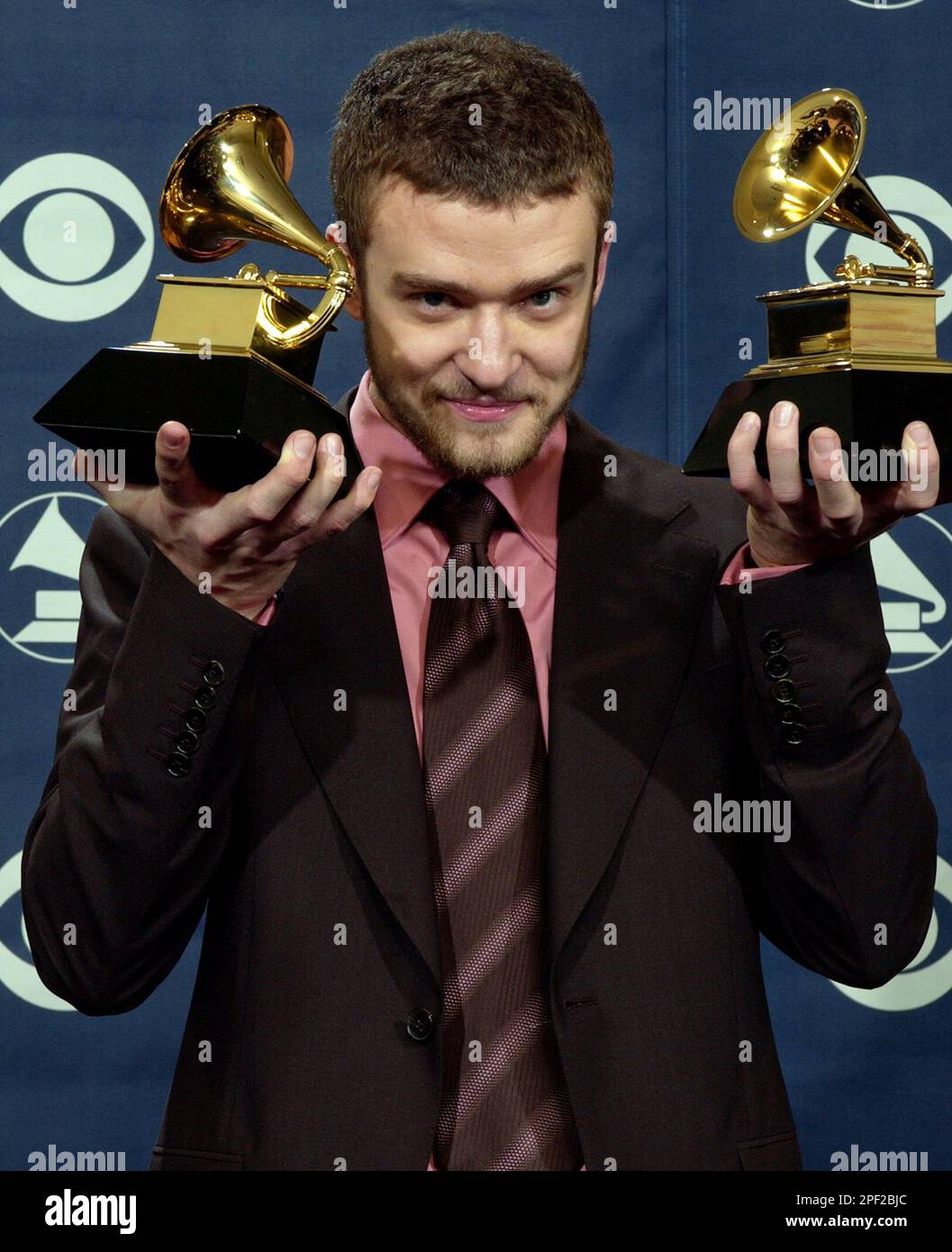 Justin Timberlake holds the awards he won for best male pop vocal ...