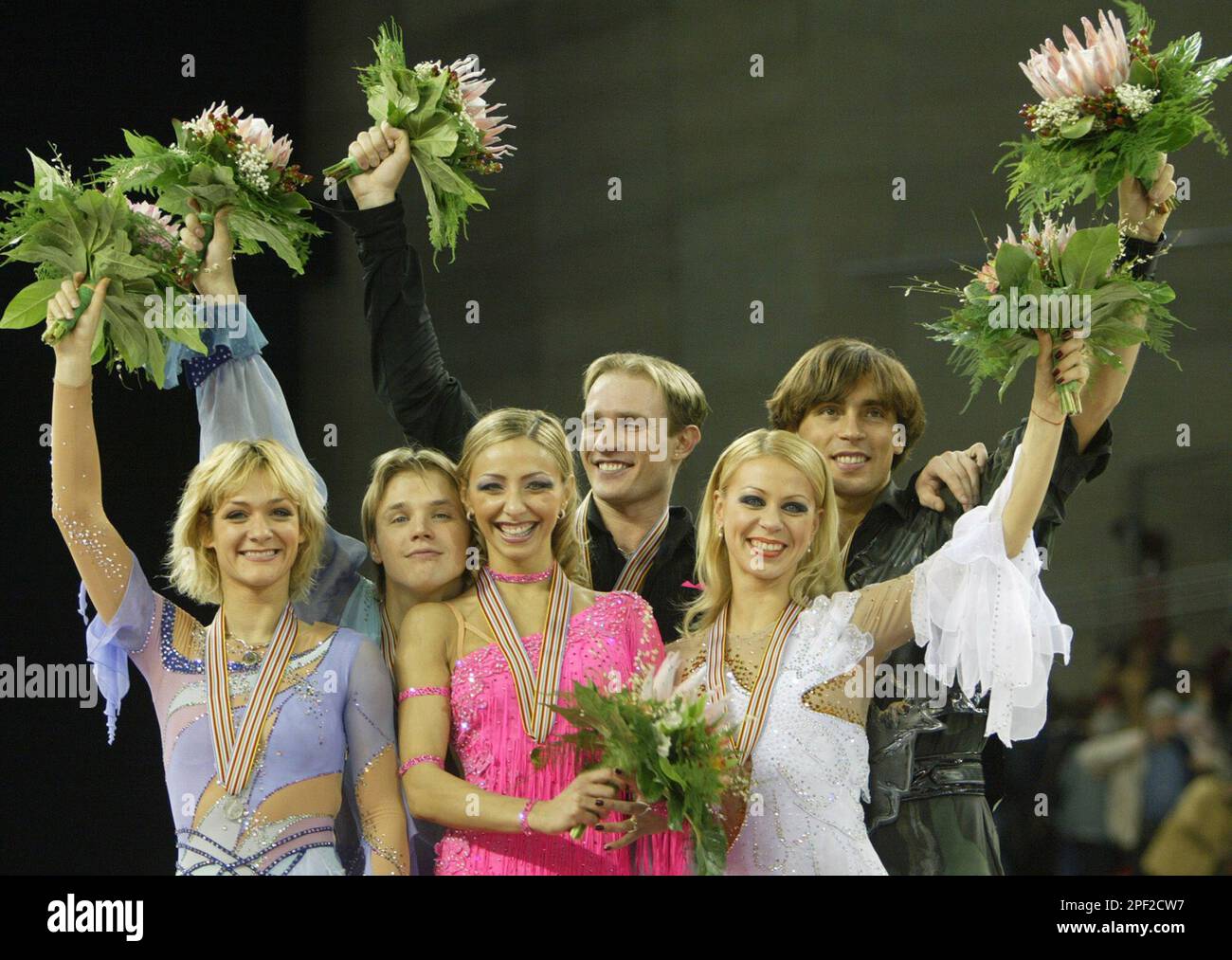 Winners of the ice dancing competition stand on the podium after the ...