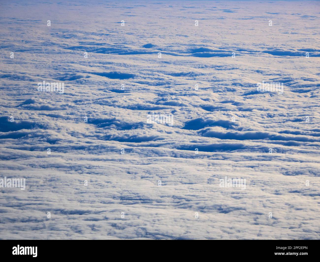 Looking down on cloud from an airplane flying over northern UK Stock ...