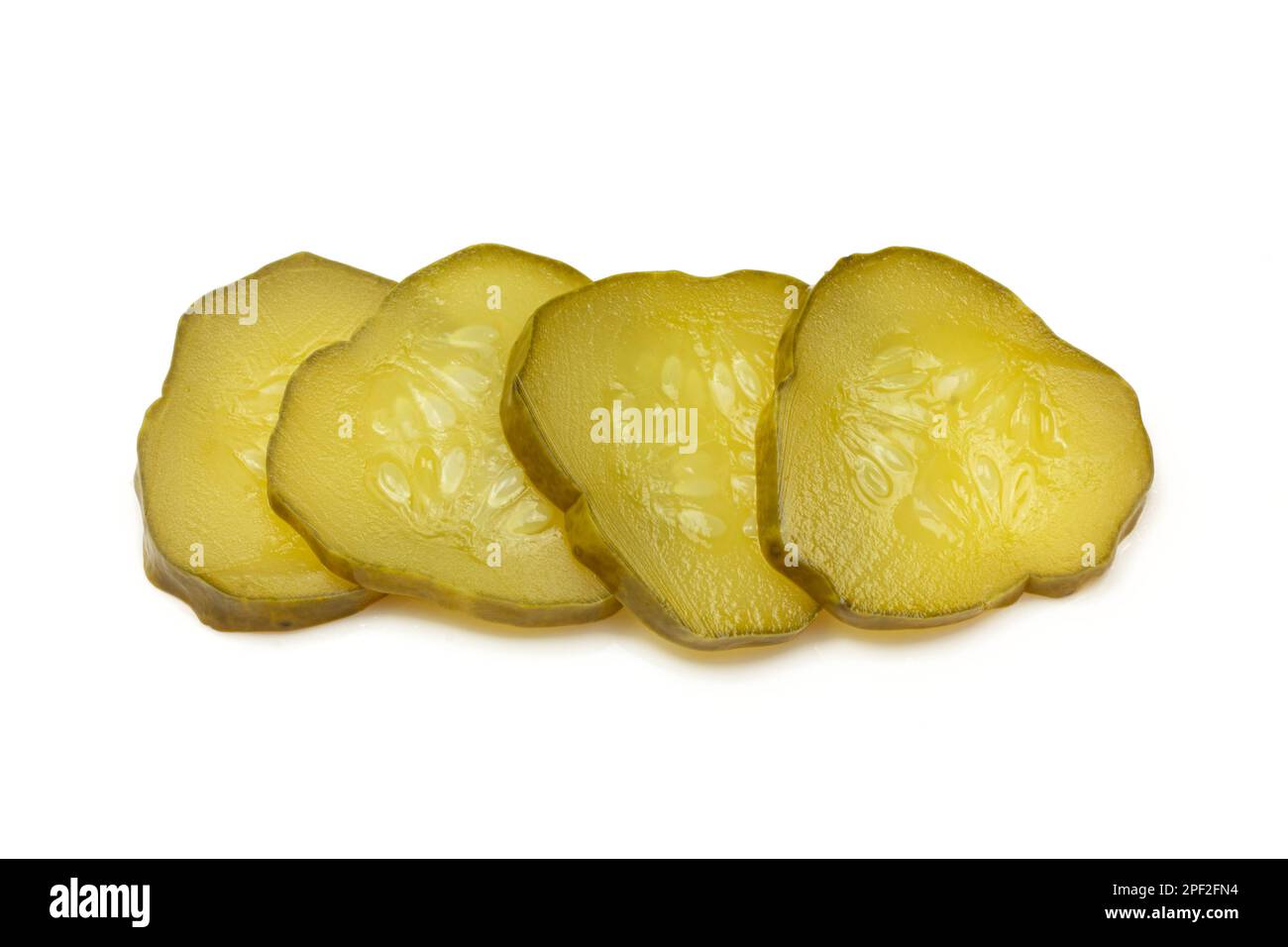 Sliced pickles isolated on white background. Cucumber vegetable pieces ...