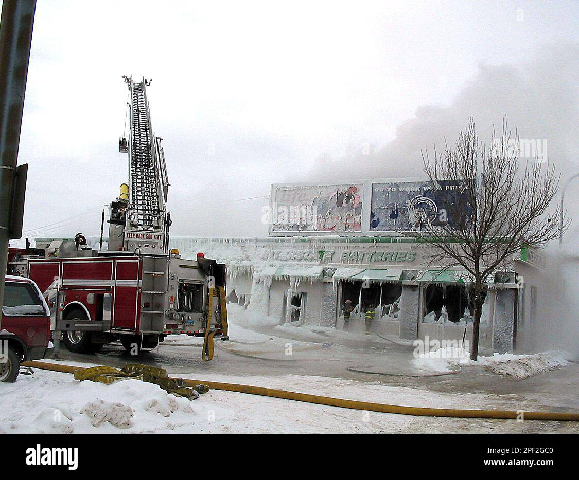 Firefighters battle a fire at Interstate Batteries in downtown Bismarck ...
